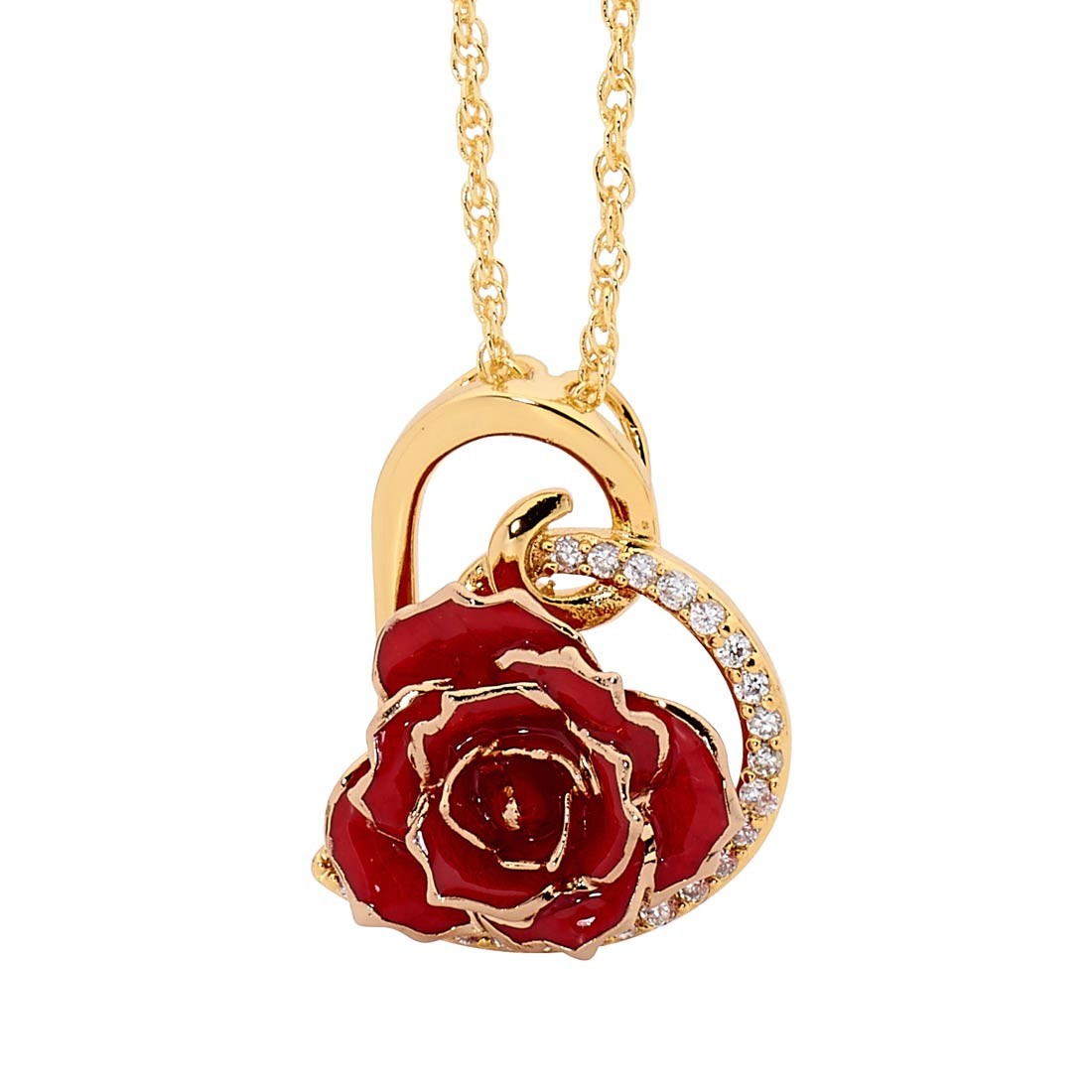 Rose trempée dans l'or et les bijoux rouges dans le thème du cœur